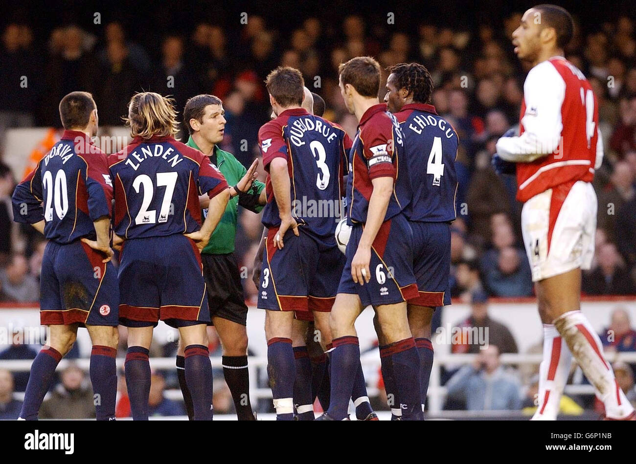 Referee Andy D'Urso is surrounded by Middlesbrough players after he ...
