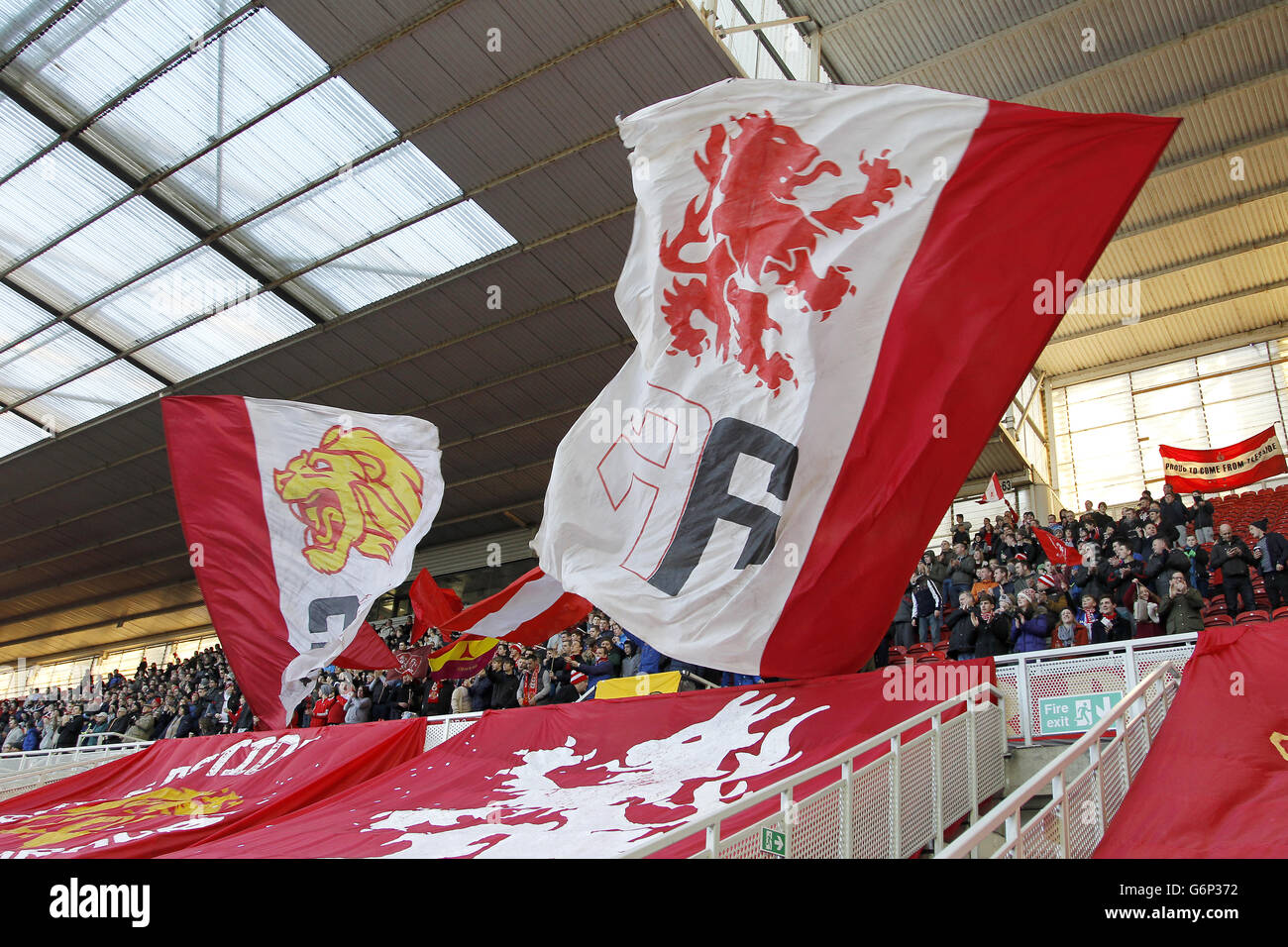 Middlesbrough fans wave flags in the stands hi-res stock photography ...