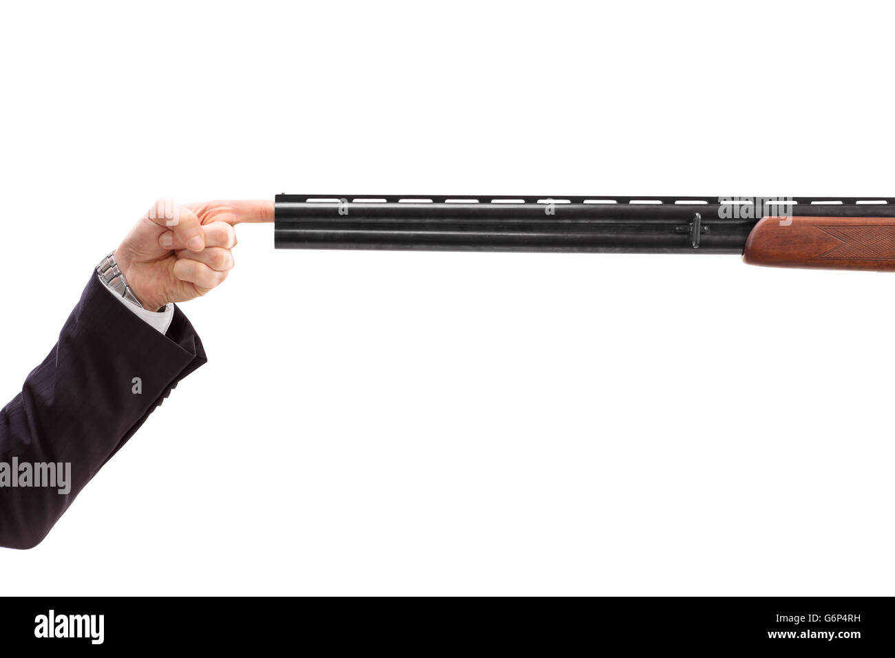Studio shot of a male finger plugging a barrel of a shotgun isolated on ...
