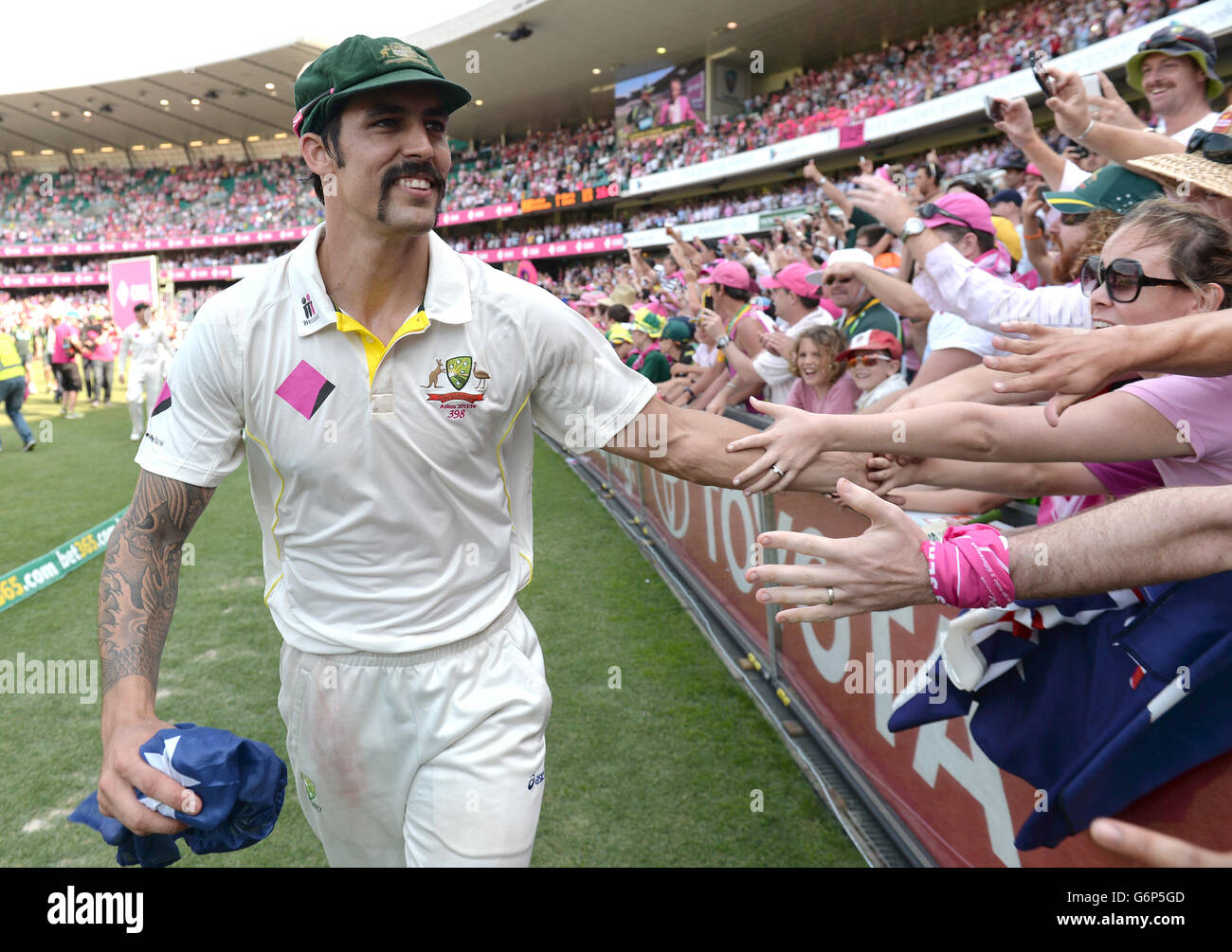 Australia's Mitchell Johnson celebrates as Australia players do a lap ...