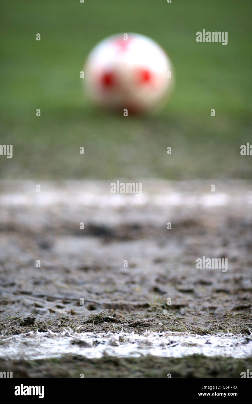 Pitch side mud at the valley with a football behind hi-res stock ...