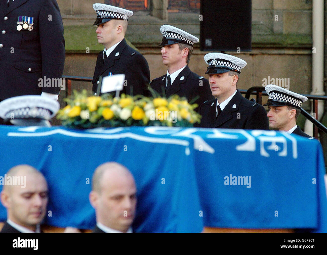 Police officer Pc Neil Roper (second right), attends the funeral of ...