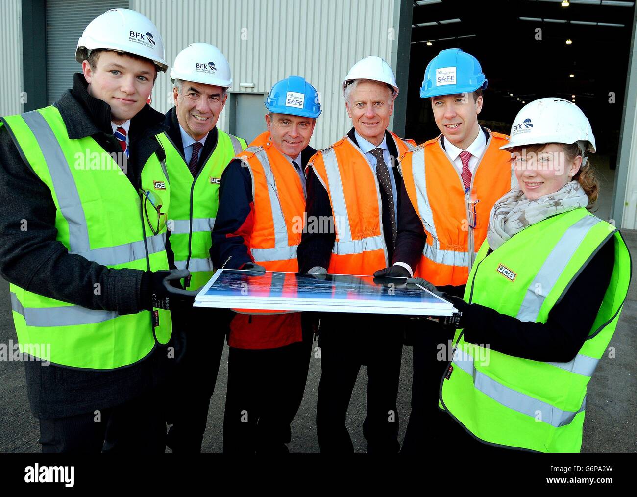 (left to right) Adam Farley an engineering student, David Bell of JCB ...