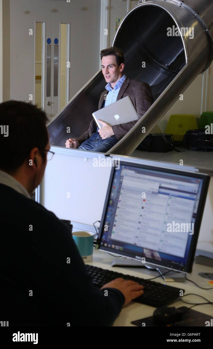 Slide workers in folkestone tech office hi-res stock photography and ...