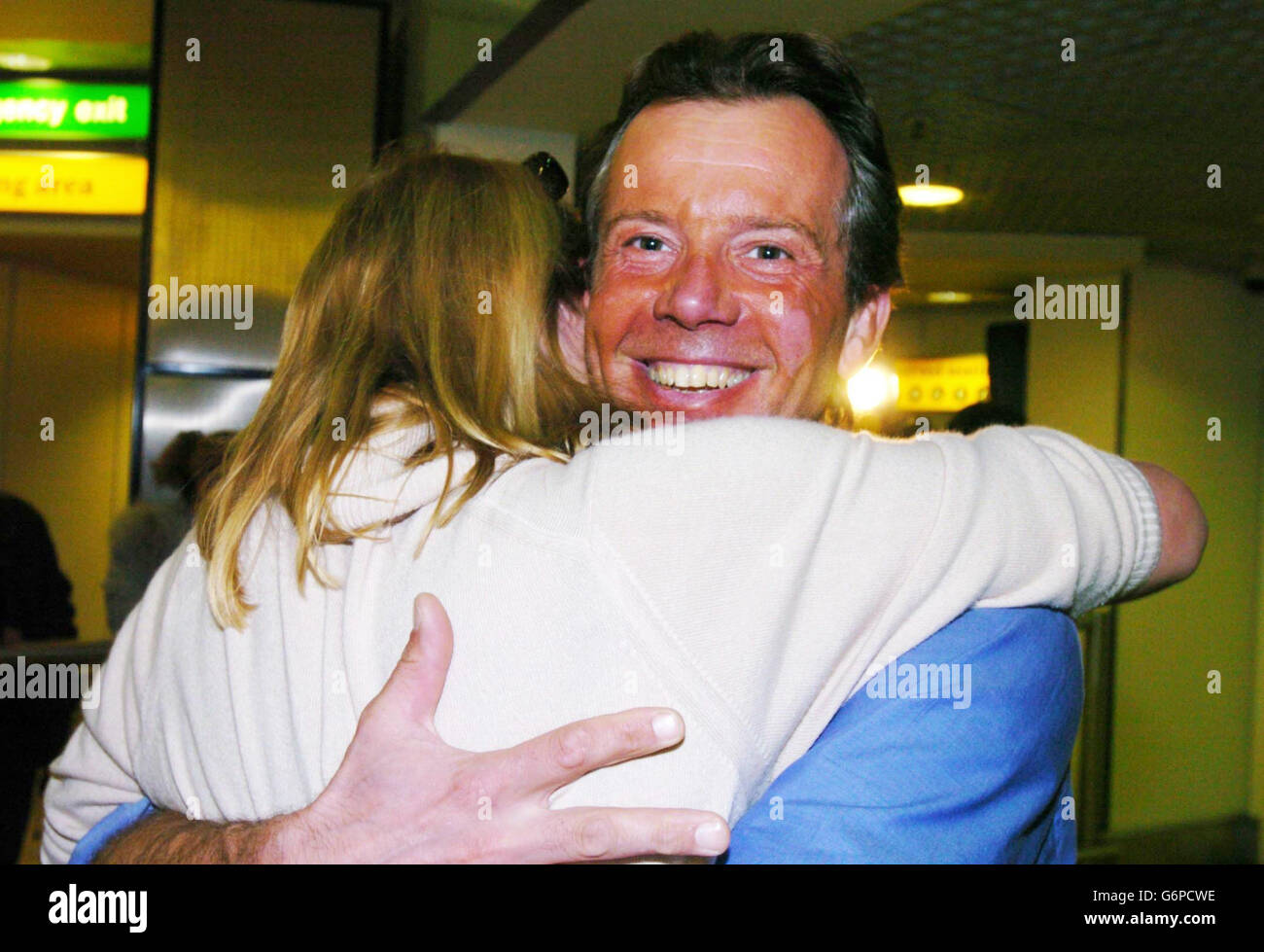 British adventurer Pen Hadow is greeted on his return home with a hug ...