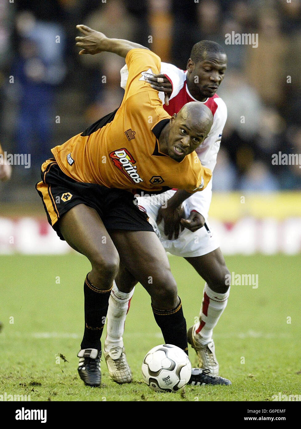 Wolverhampton Wanderers' Carl Cort (front) holds off the challenge from ...