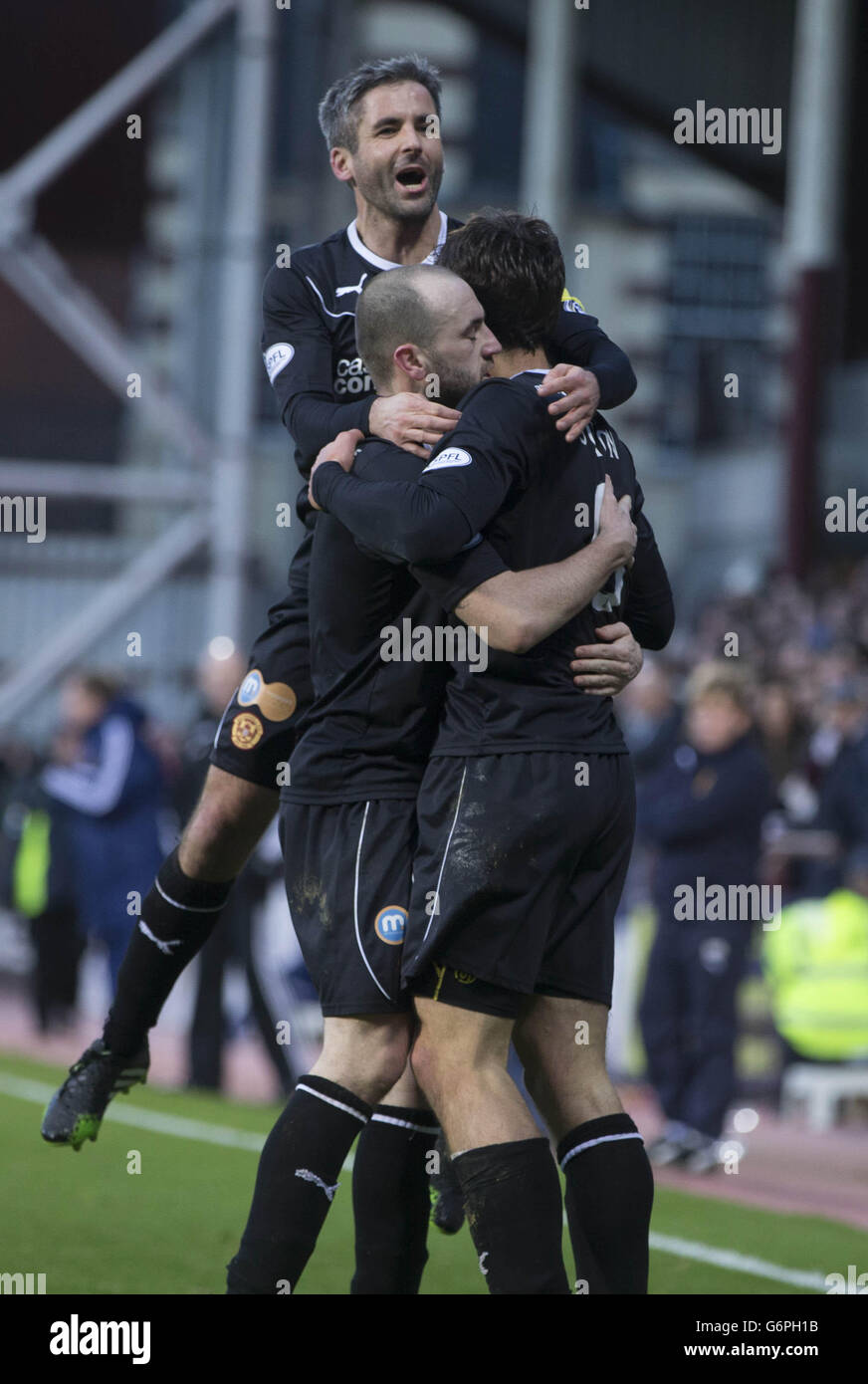 Motherwell's John Sutton celebrates with team mates after scoring ...