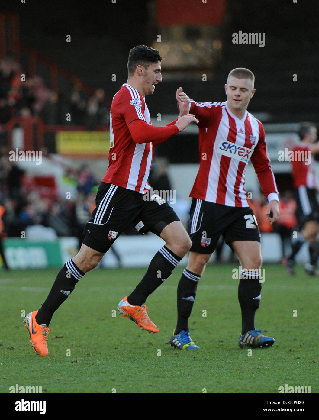 Brentford's Marcello Trotter (left) celebrates with Jake Bidwell after ...