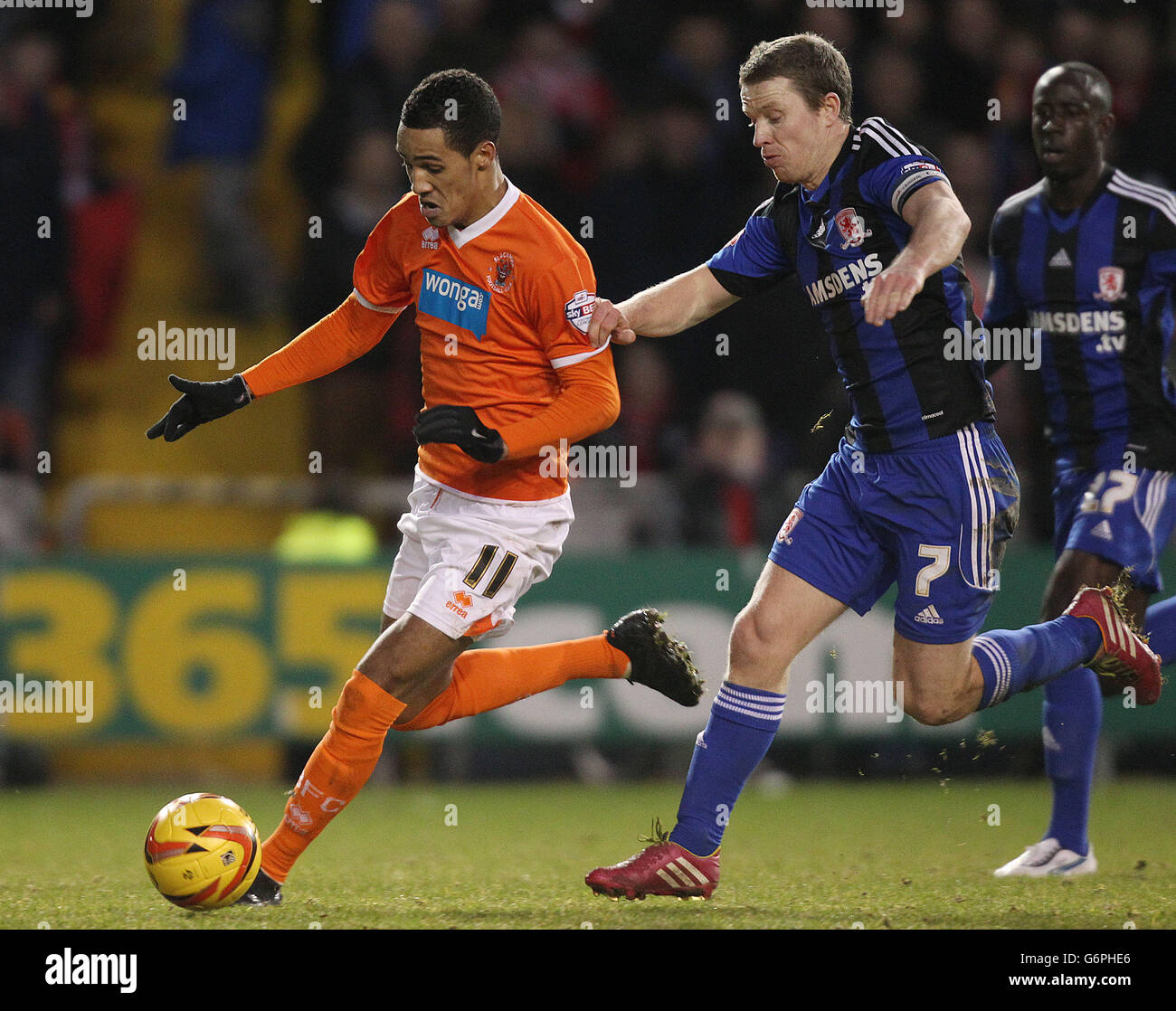 Blackpool's Tom Ince and Middlesbrough's Grant Leadbetter in action ...