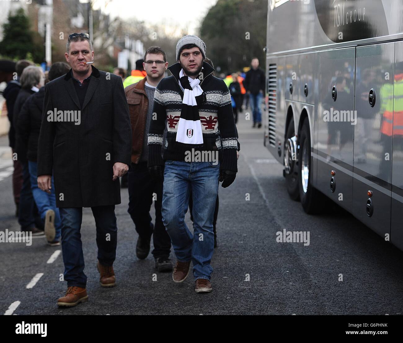 Fans make their way to the stadium before kick off hi-res stock ...