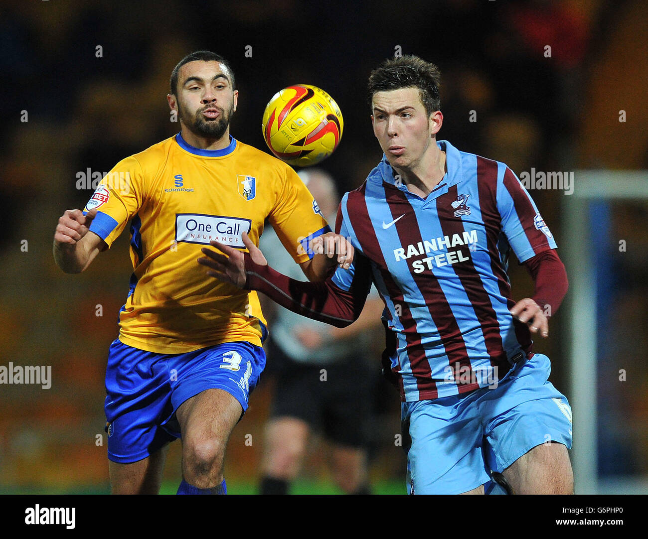 Scunthorpe United's Niall Canavan and Mansfield Town's Colin Daniel ...