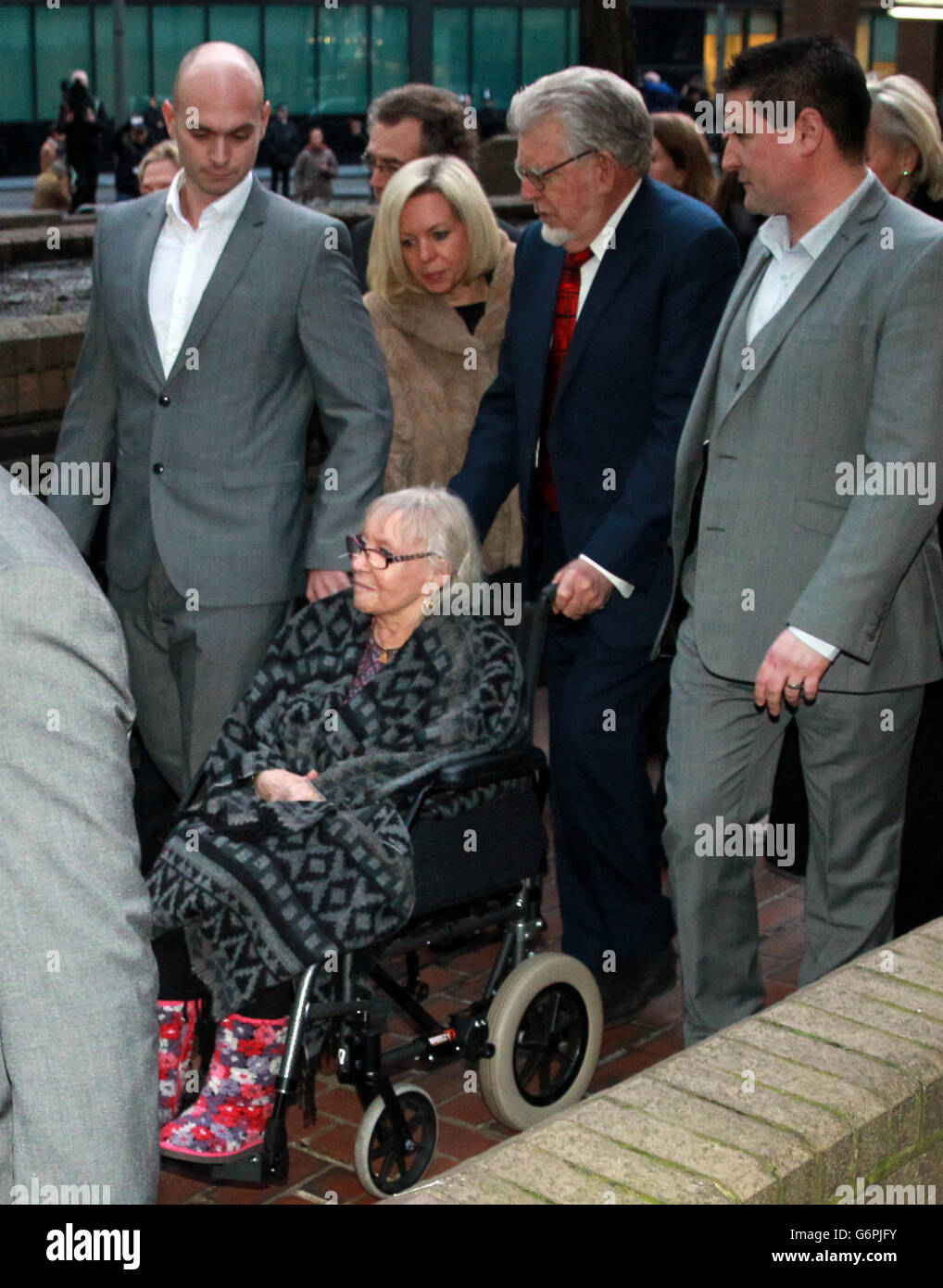 Rolf harris pushes his wife alwen in a wheelchair hi-res stock ...