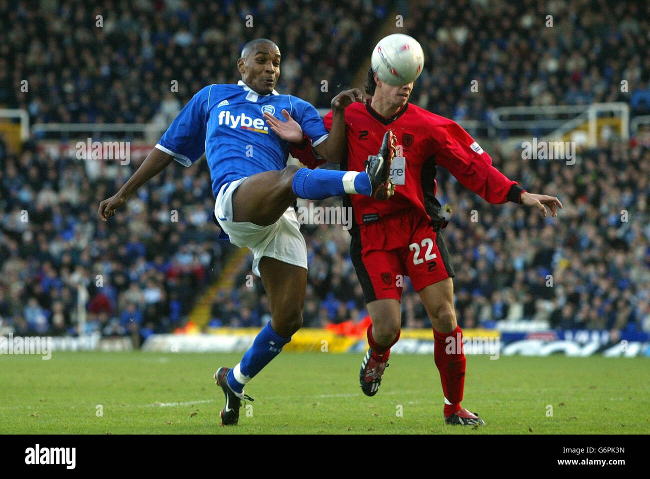 Birmingham's Clinton Morrison (left) and Wimbledon's Rob Gier battle it ...