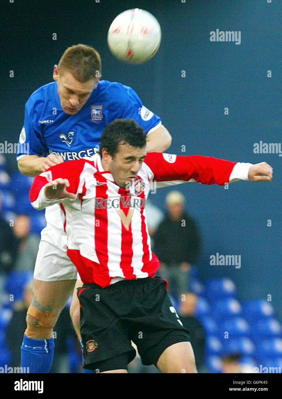 Ipswich's Richard Naylor rises above Sunderland's Julio Arca during the ...