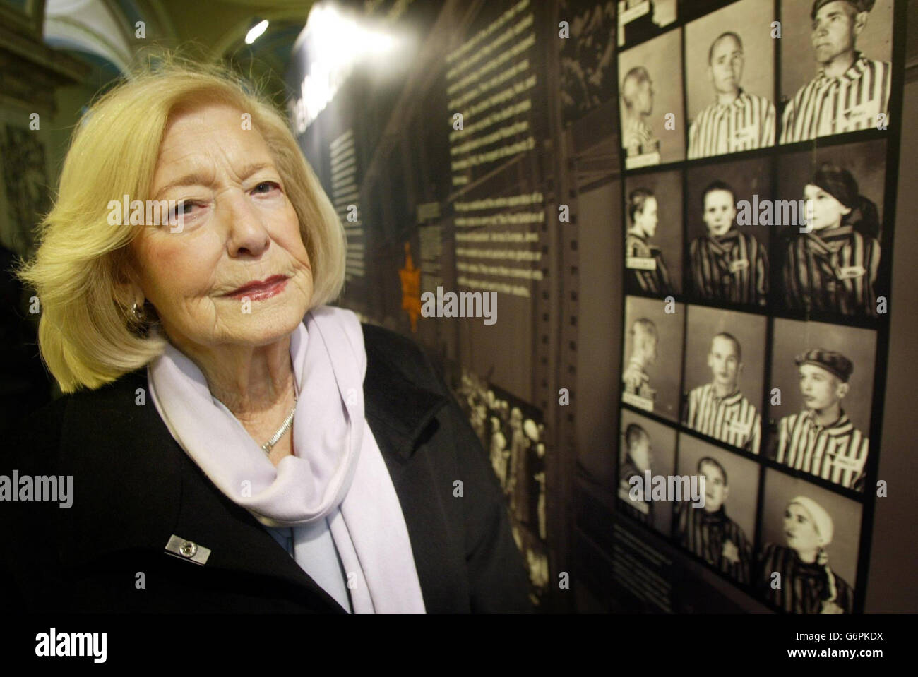 Holocaust Survivor Gena turgel, examines a Holocaust Memorial board at ...