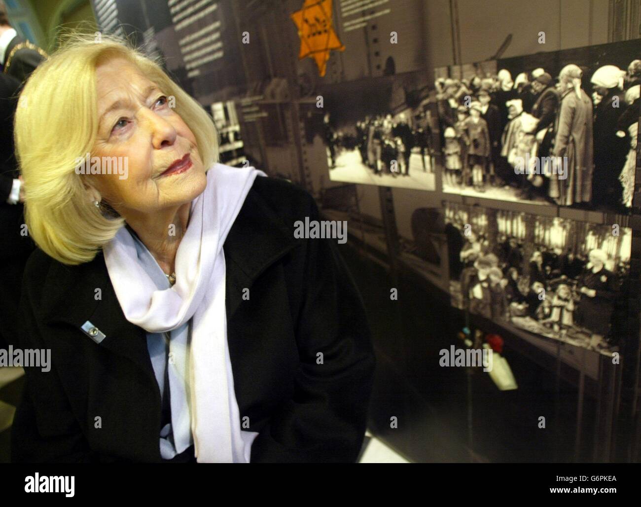 Holocaust suvivor, Gena Turgel, examines a Holocaust memorial board at ...