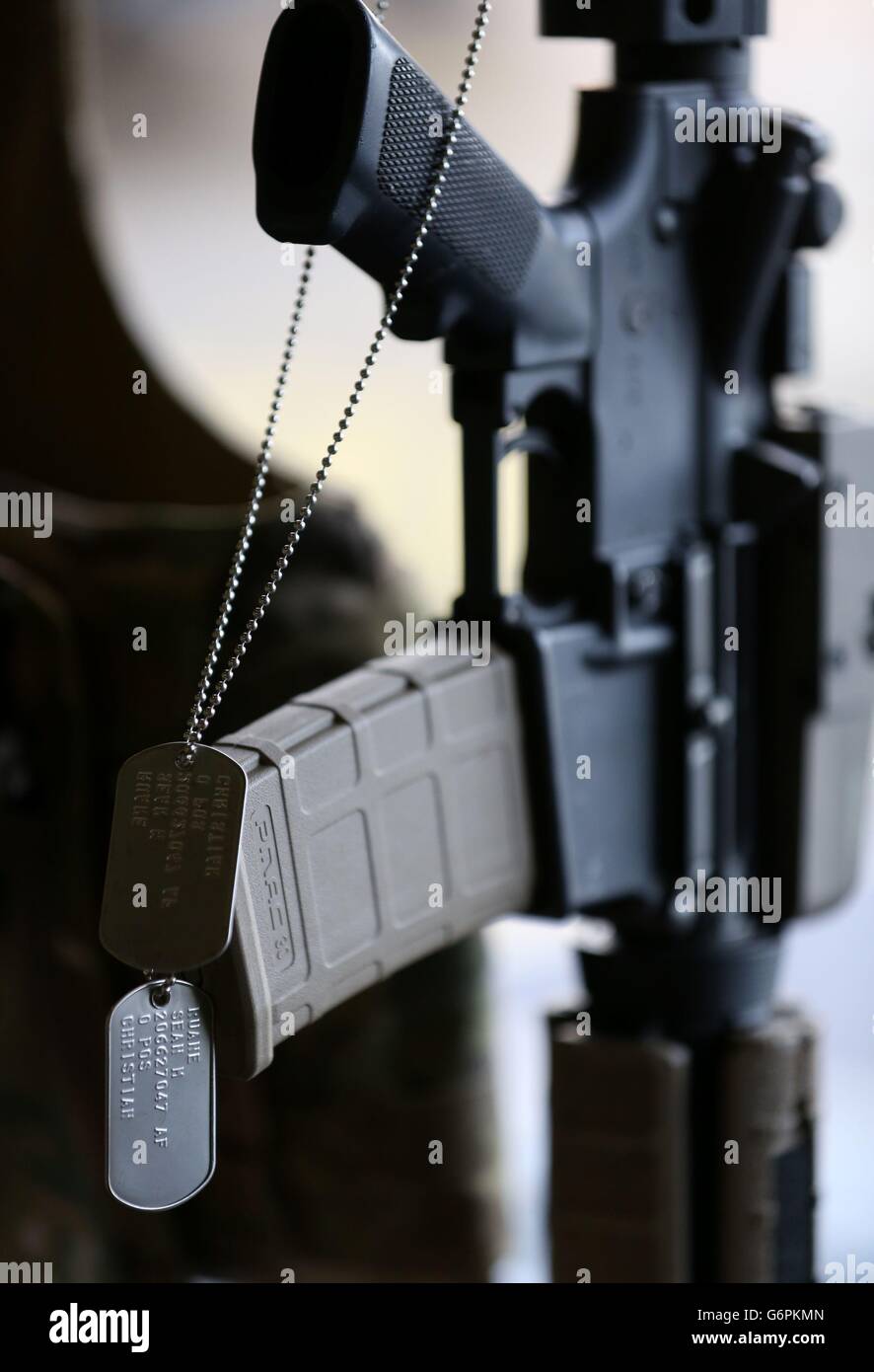 The dog tags of Captain Sean Ruane, rest on a rifle during a memorial ...