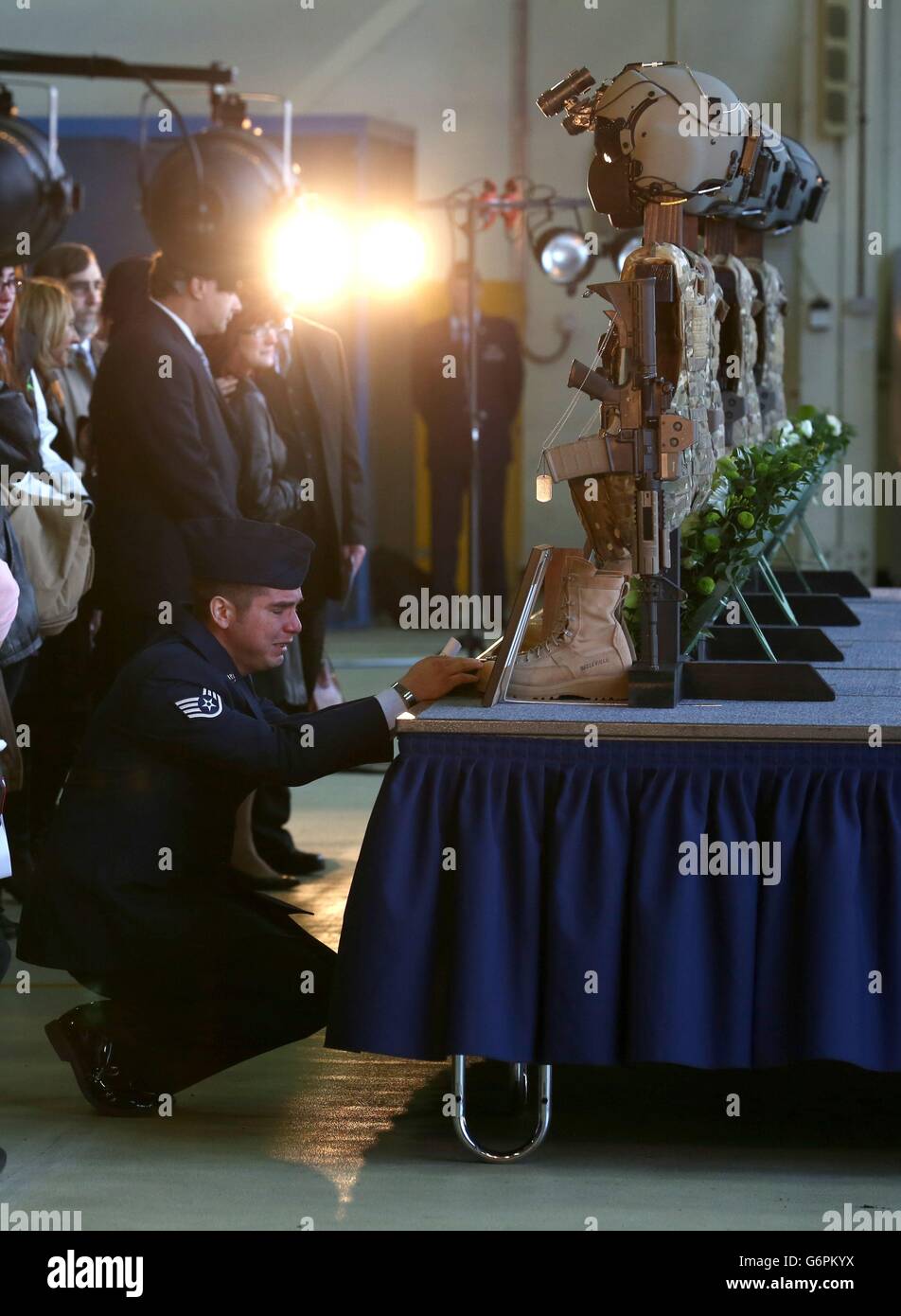 Andy Ponce, the husband of SSGT Afton Ponce, pays his respects in front ...