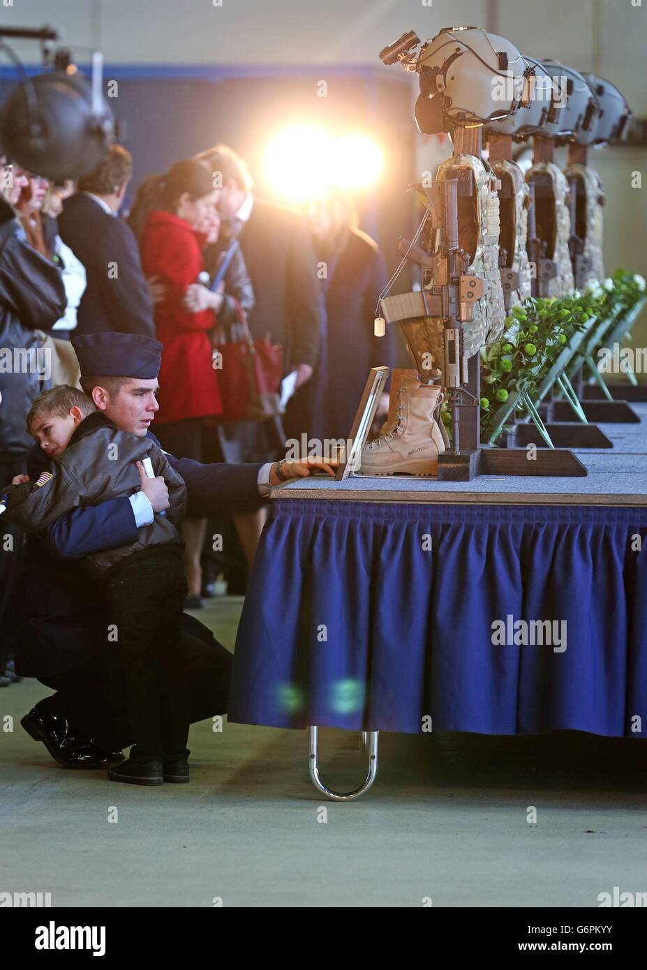 Andy Ponce, the husband of SSGT Afton Ponce, pays his respects in front ...