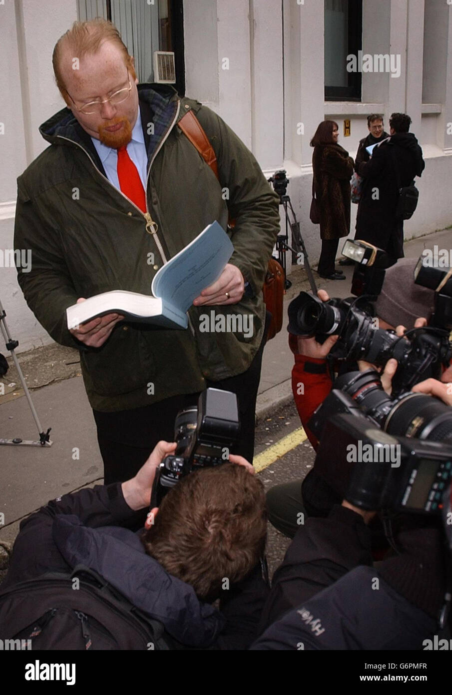 Journalists collect the Hutton Report into the death of weapons expert ...