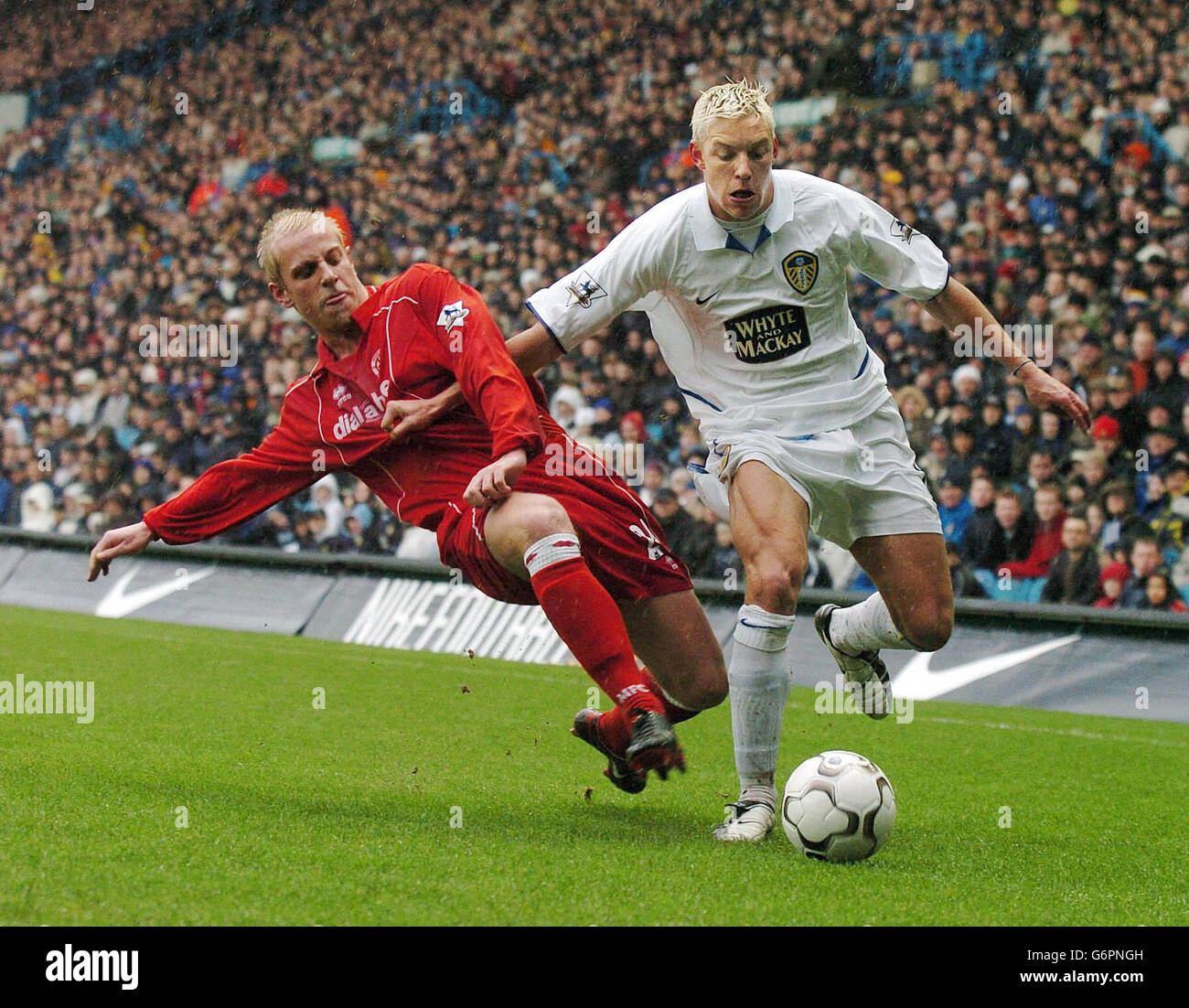 Alan Smith of Leeds United (R) holds off Andrew Davies of Middlesbrough ...