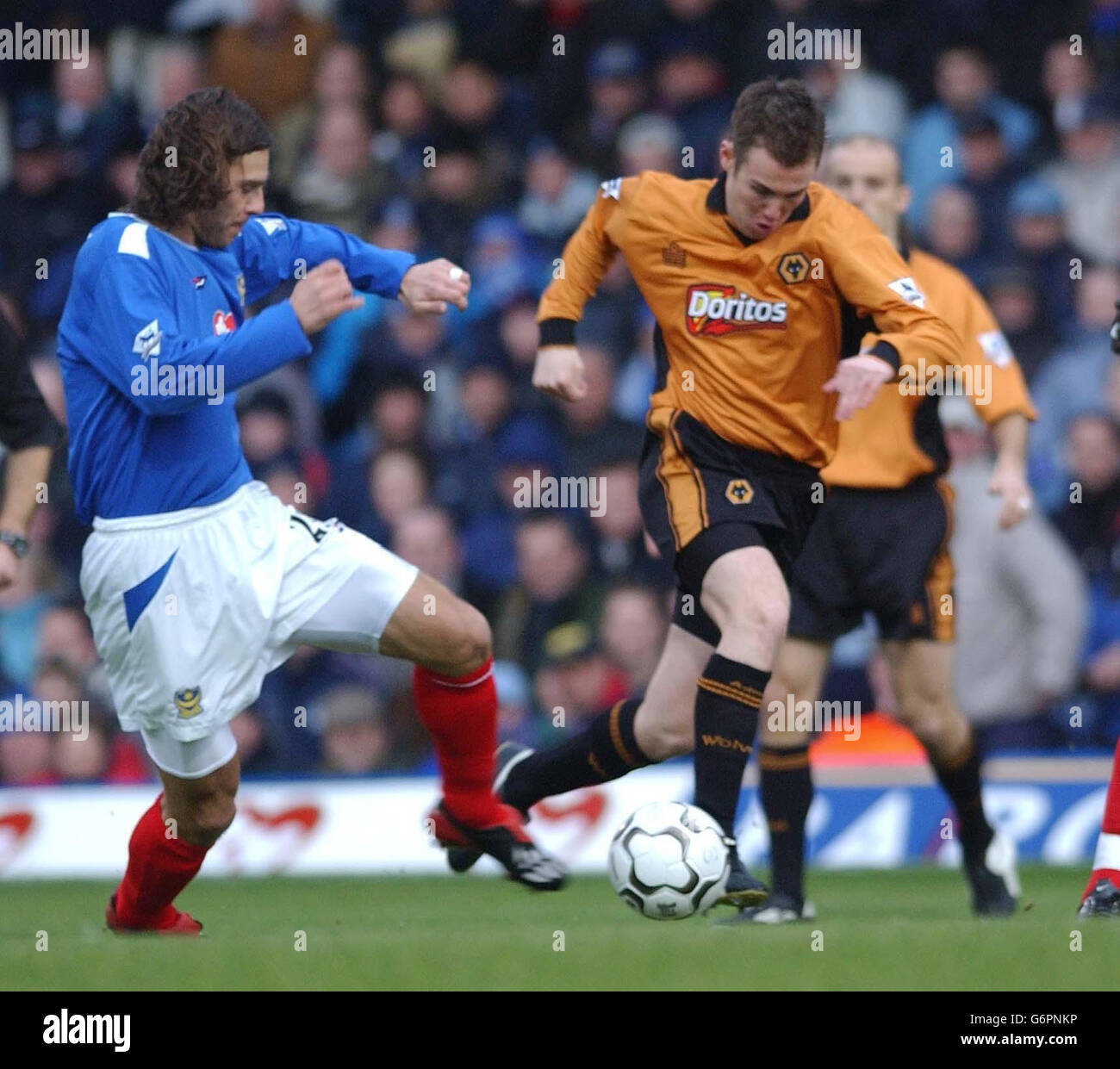 Wolves' Kenny Miller (R) breaks past Portsmouth's Patrik Berger during ...