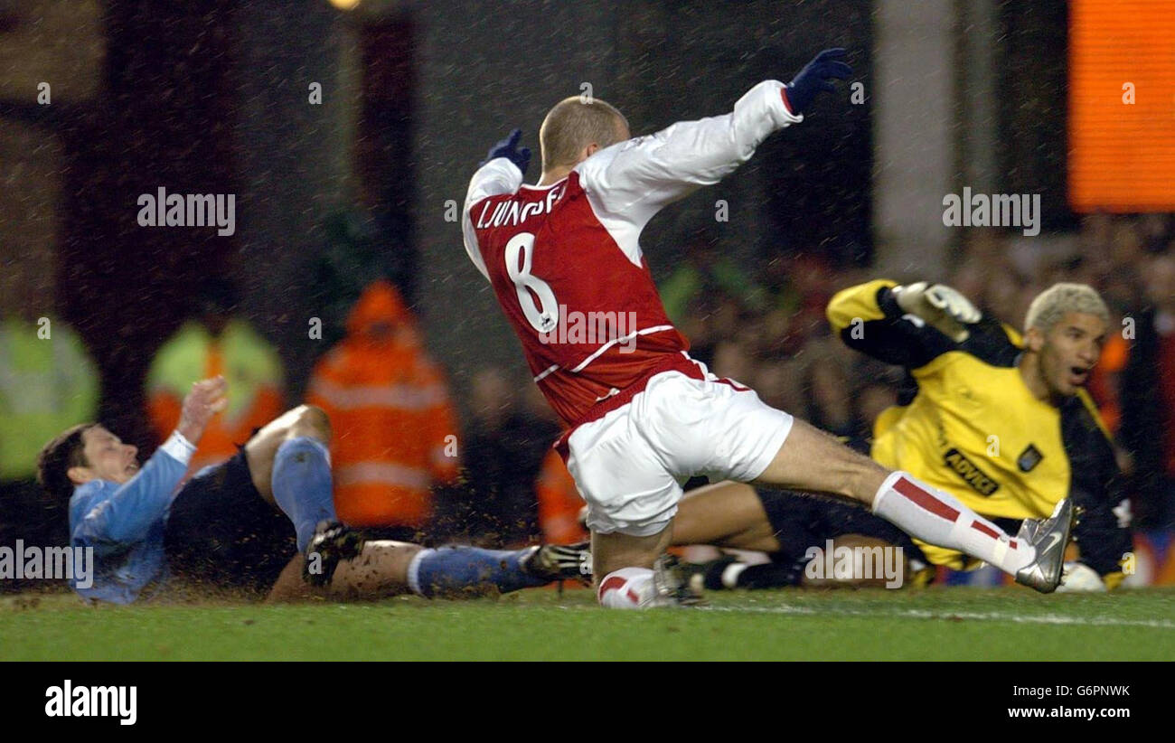 Manchester City's goalkeeper David James (right) is beaten by an own ...