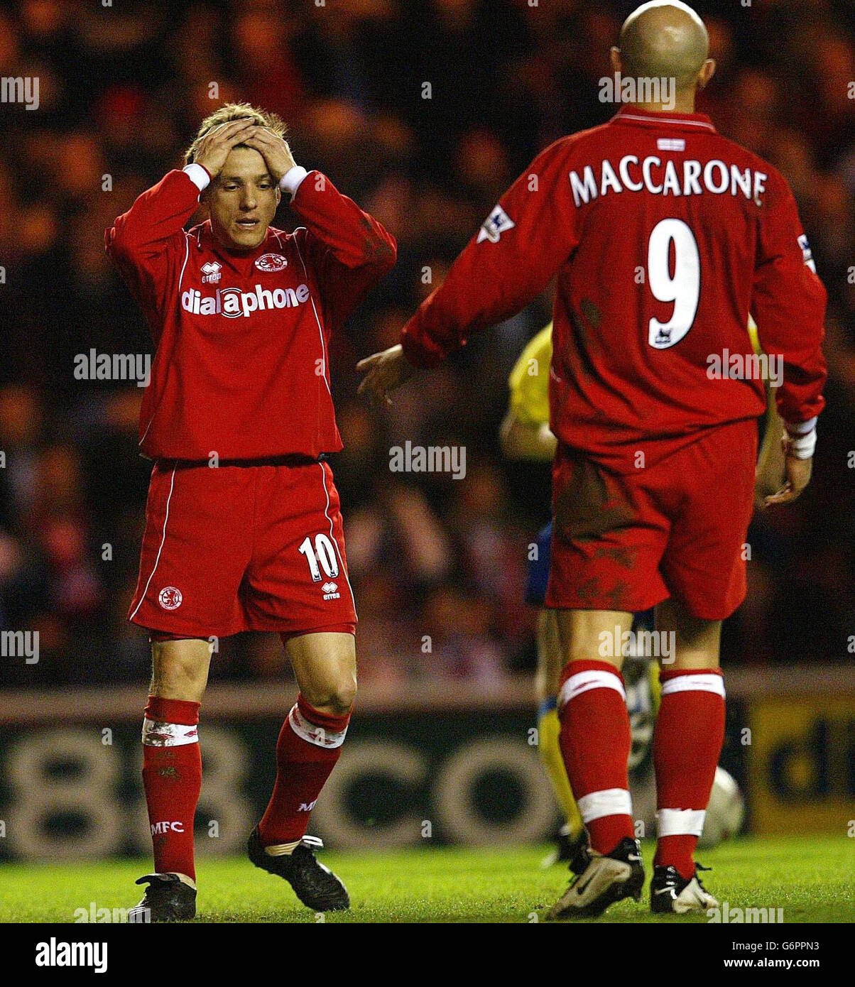 Middlesbrough's Juninho (left) holds his head in frustration after ...