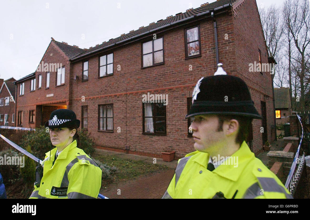 Police guard a house at murder scene Stock Photo - Alamy