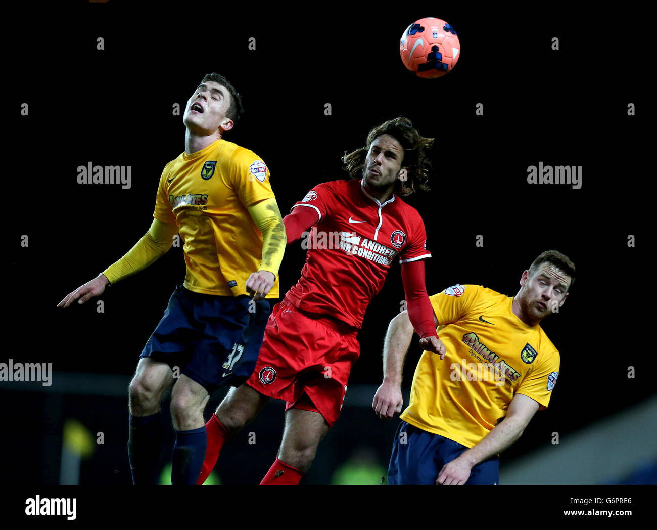 Oxford United's Josh Ruffels (left) and Deane Smalley (right) battle ...