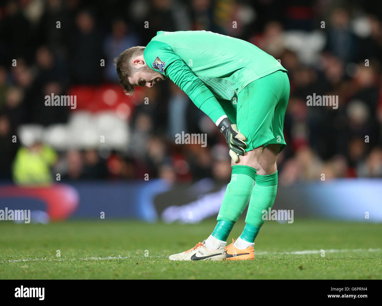 Manchester United's keeper David de Gea stands dejected after his ...