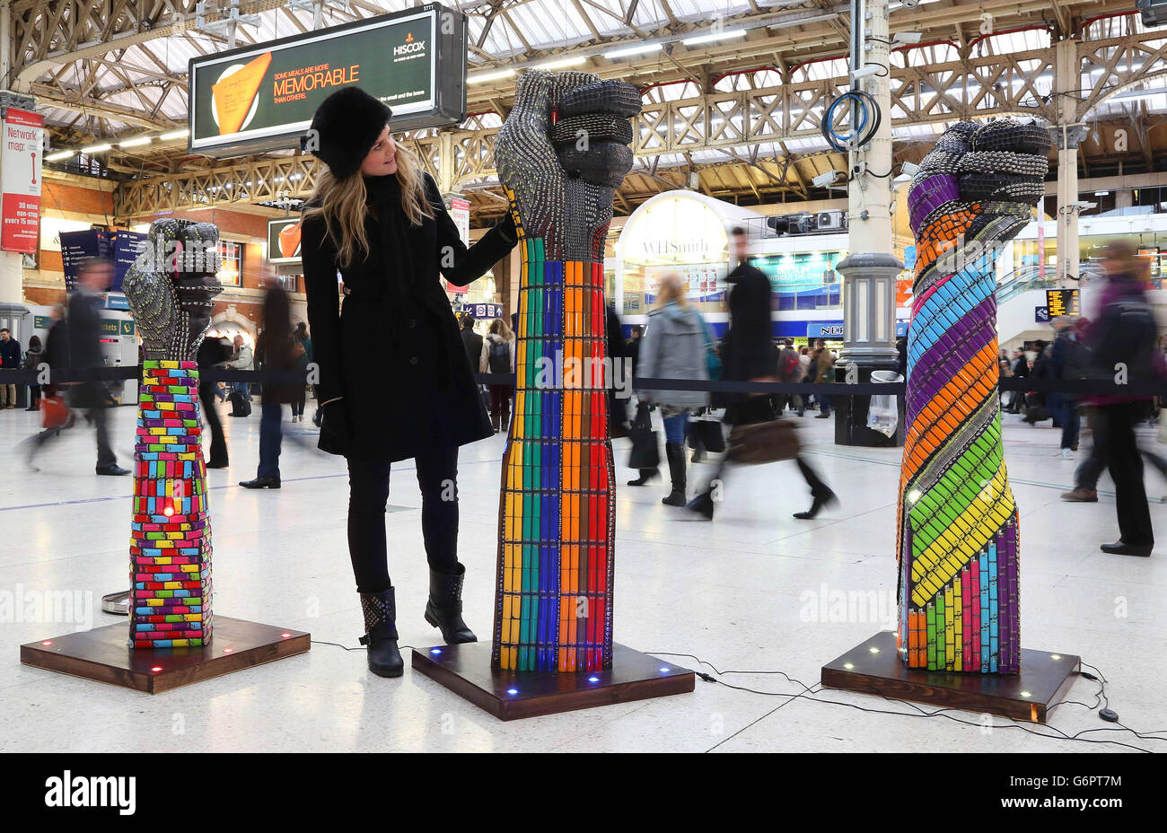 Commuter Ciara Bailey looks at an installation of three arm-shaped ...