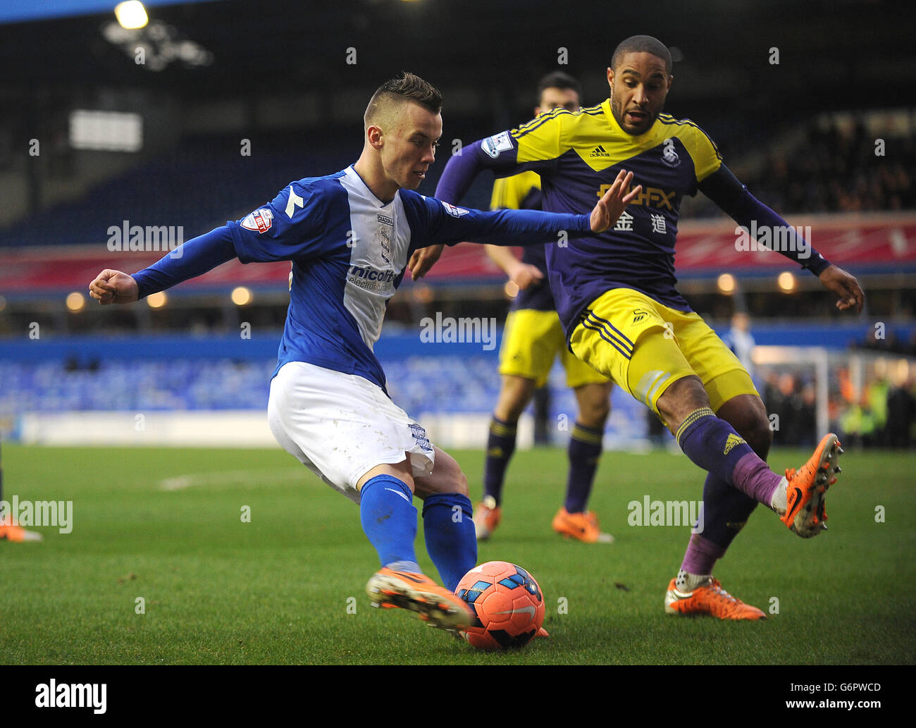 Birmingham City's Al;bert Rusnak (left) crosses the ball under pressure ...