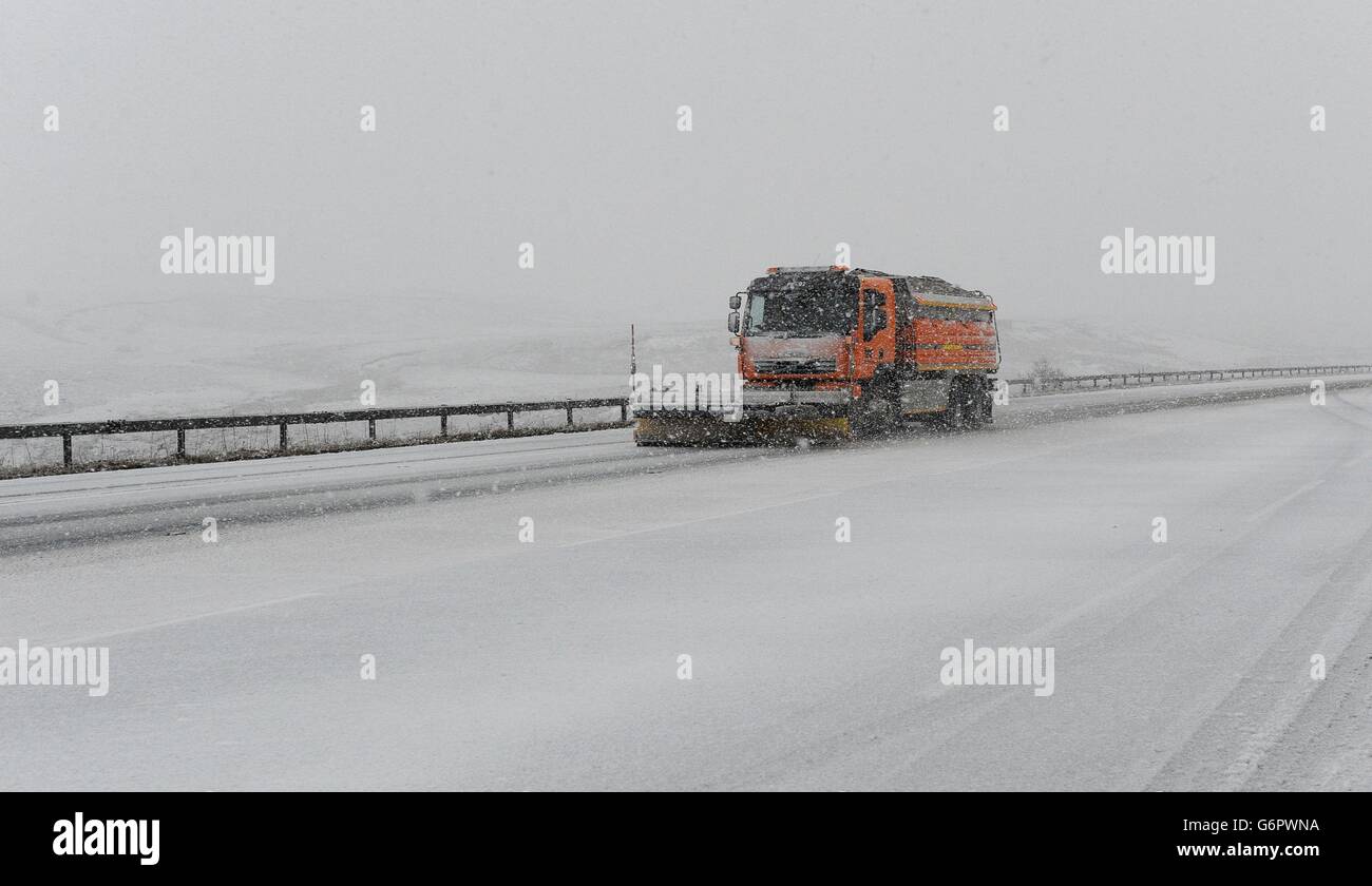 A snow plough makes its way along the A66 as hill snow falls in the ...