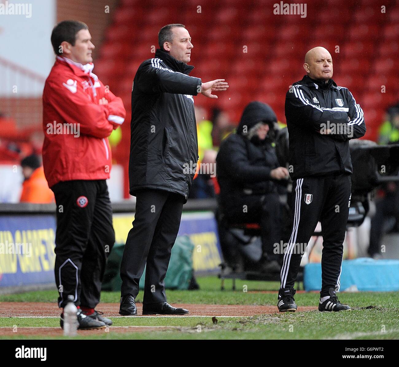 Fulham manager Rene Meulensteen (centre) and assistant head coach Ray ...