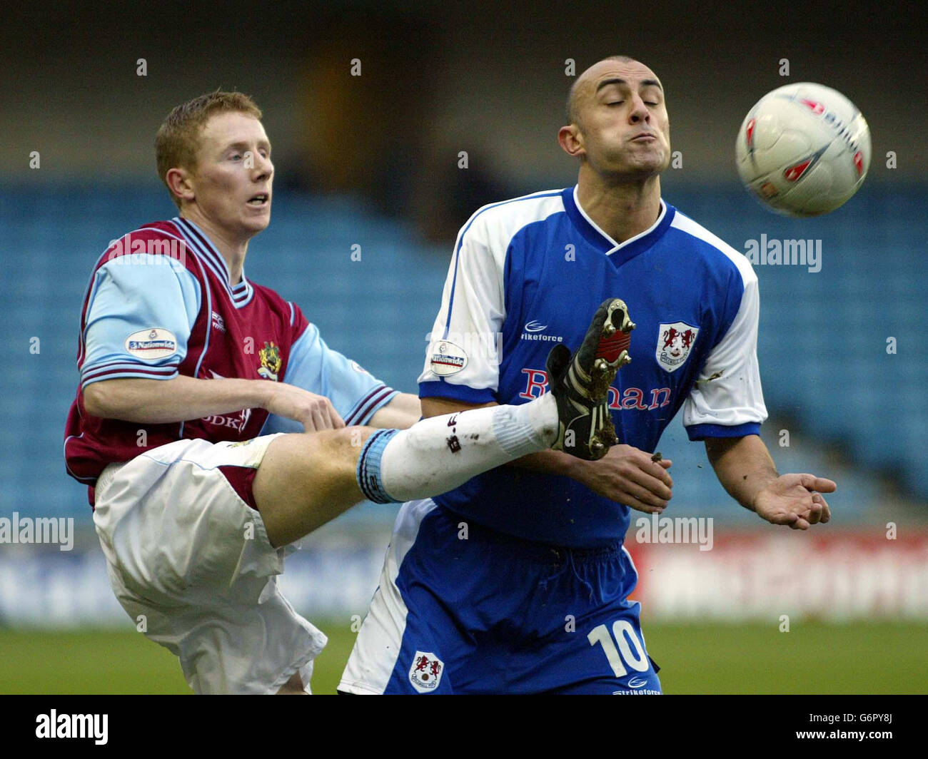 Millwall's Danny DiChio (right) tussles for the ball with Burnley's Lee ...