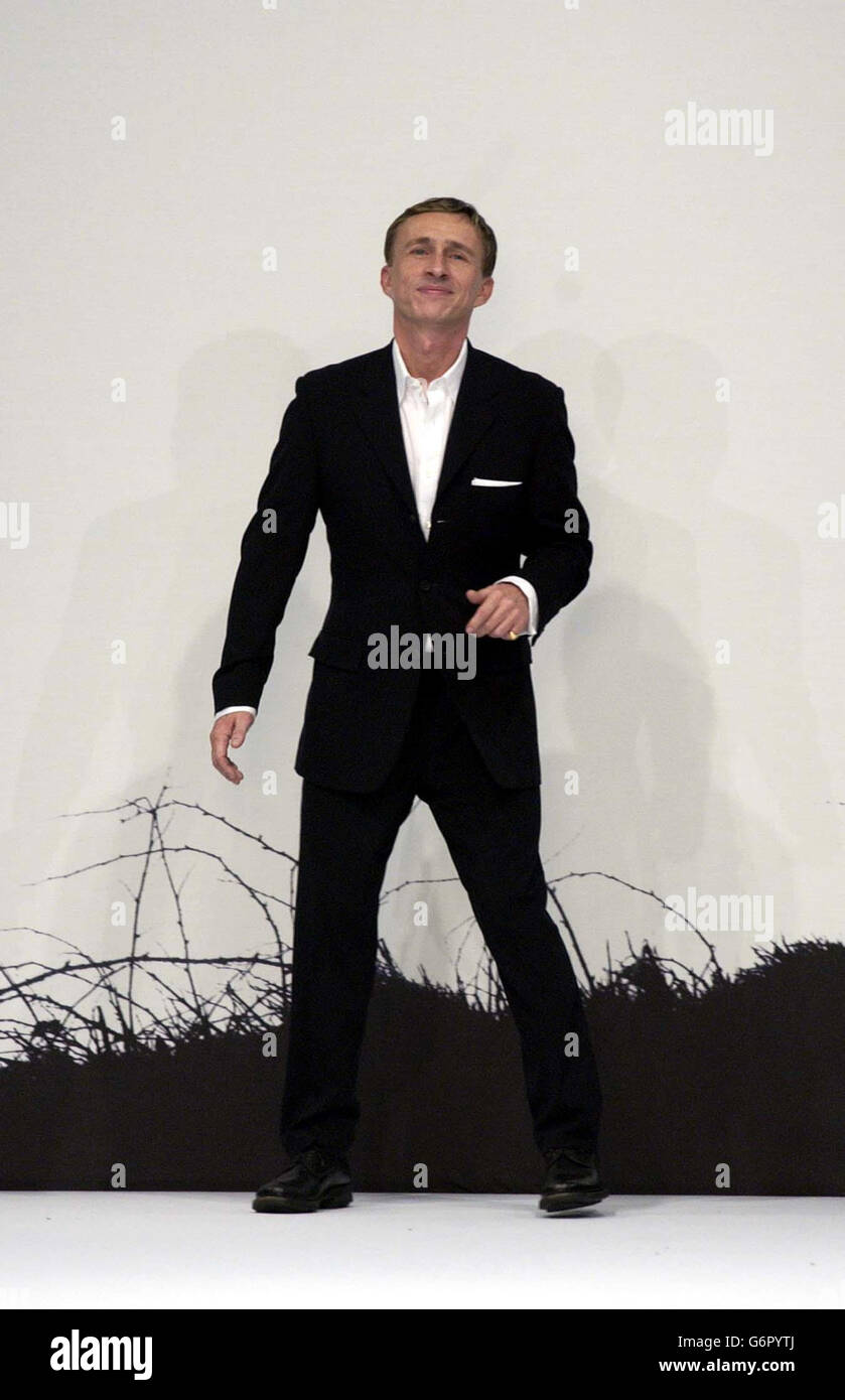 Fashion designer Jasper Conran takes to the stage after showcasing his ...