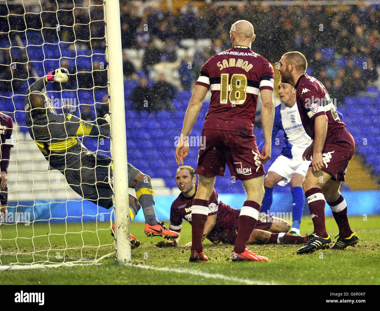 Birmingham City's Federico Macheda (third right) scores the third goal ...