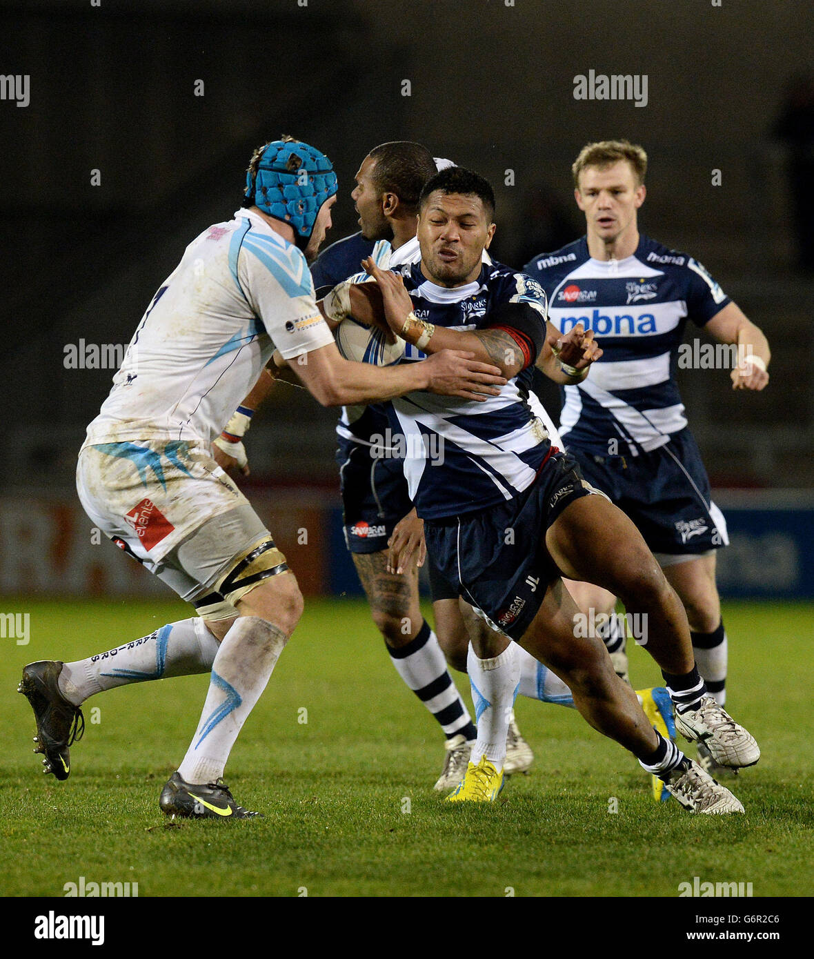 Sale Sharks' Johnny Leota is tackled by Worcester Warriors' Richard de ...