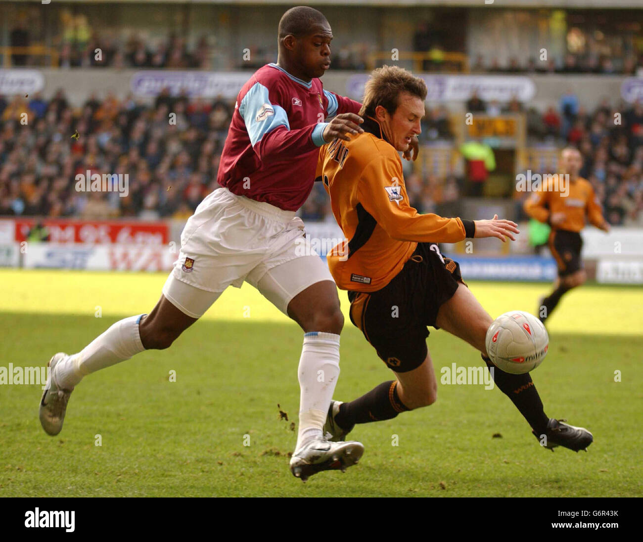 West Ham striker Marlon Harewood (left) challenges Wolves player Lee ...