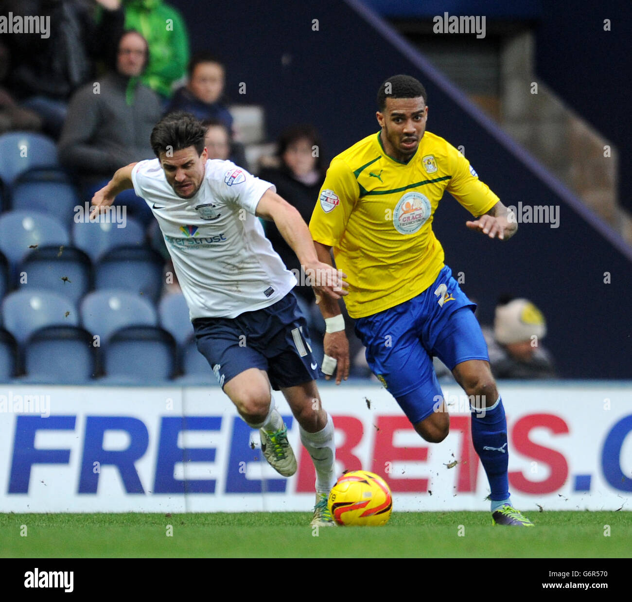 Preston North End's David Buchanan (left) and Coventry City's Cyrus ...