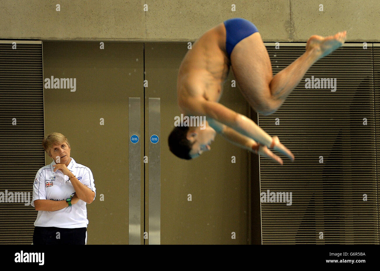 Great Britain's Tom Daley is watched by his new Coach American Jane ...