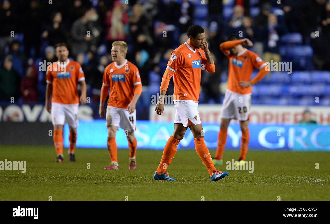 Blackpool's Nathan Tyson (2nd right) and his team mates look dejected ...