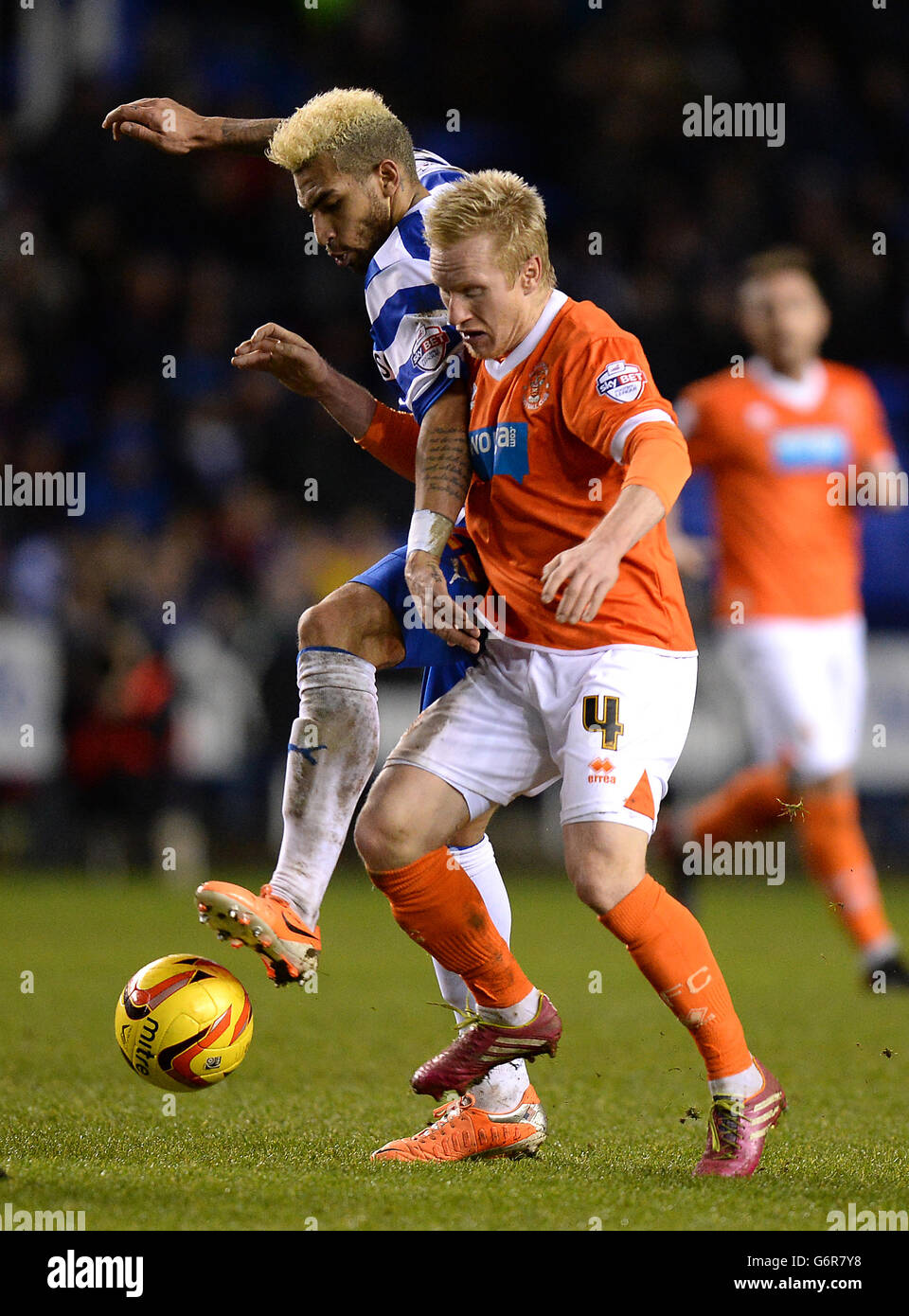 Blackpool's David Perkins and Reading's Daniel Williams (left) battle ...
