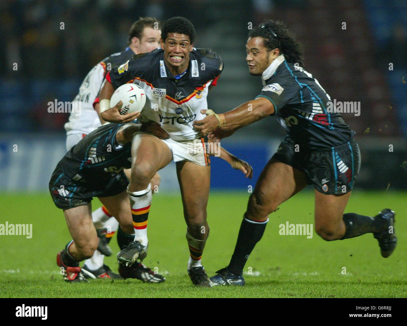 Bradford Bulls Leon Price breaks tackles from Penrith Panthers Luke ...