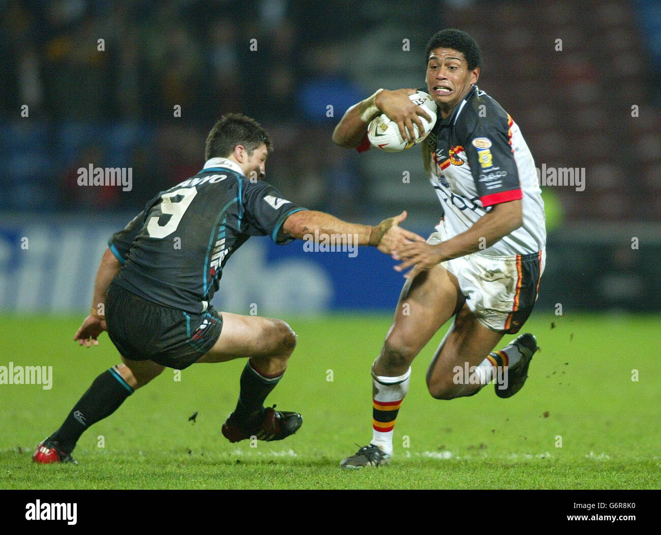 Bradford Bulls Leon Price breaks a tackle from Penrith Panthers Luke ...