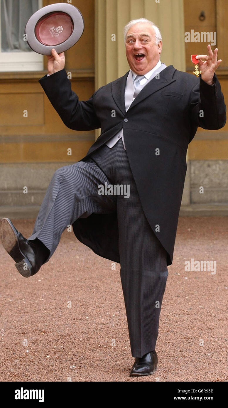Roy Hudd holds his OBE Stock Photo - Alamy