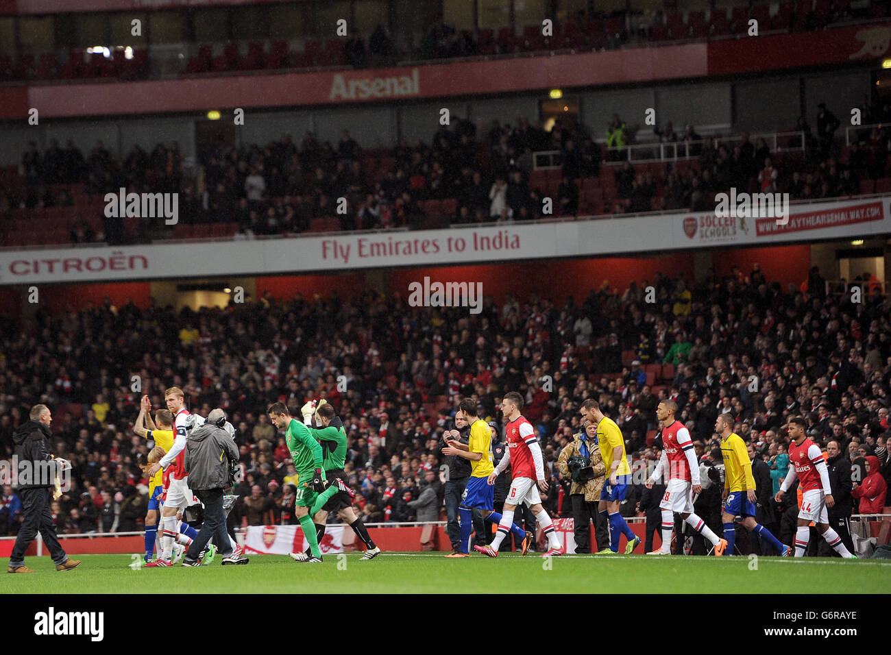 Arsenal walk onto the Emirates Stadium at the start of the game Stock ...