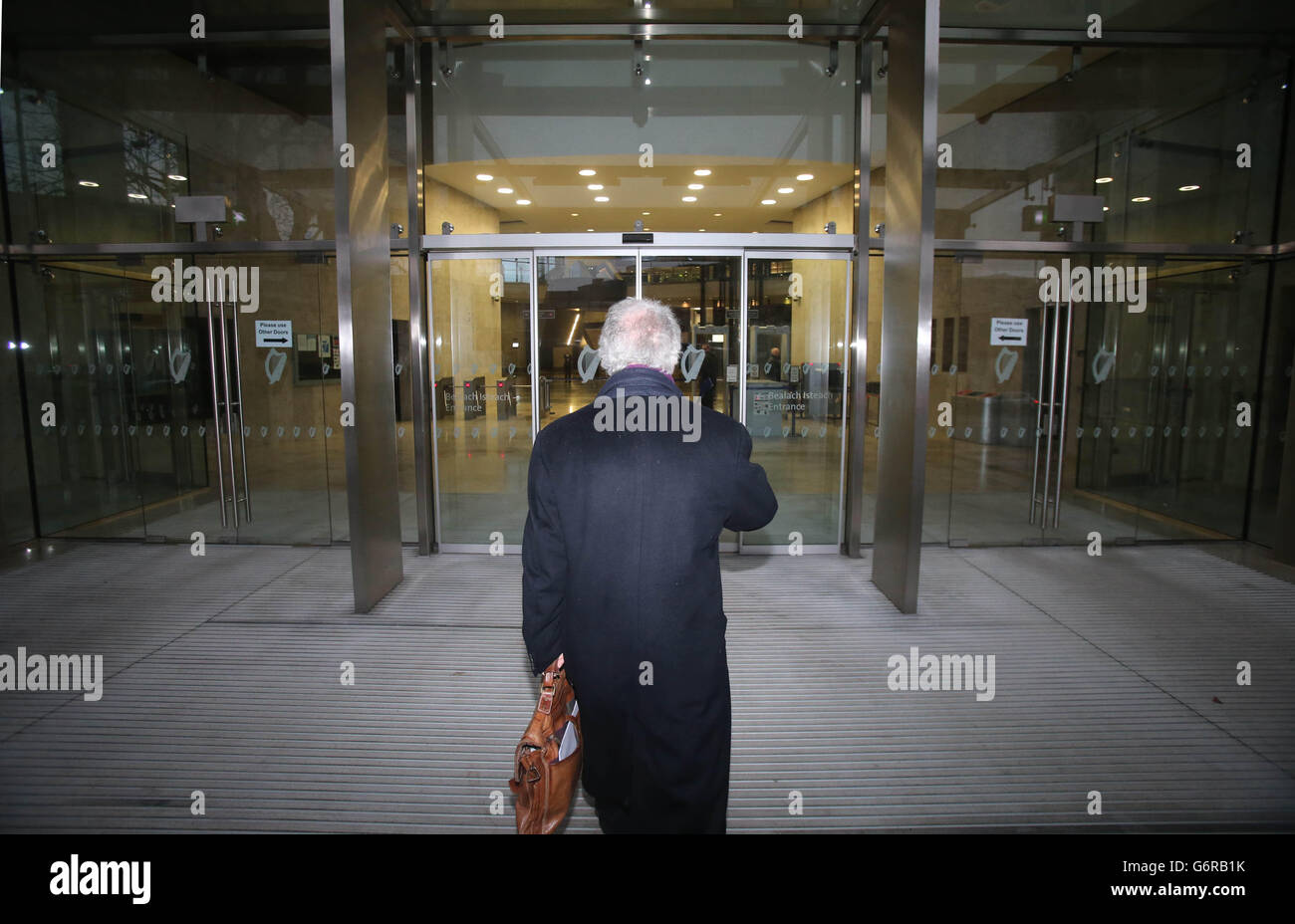 Sean Fitzpatrick, former chairman of Anglo Irish Bank, arrives at the ...