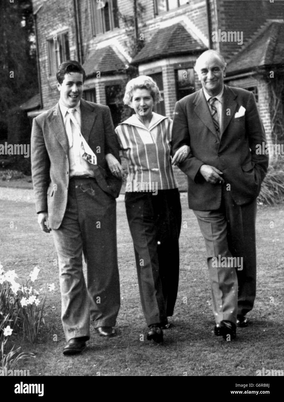 Lady Docker arm-in-arm with her husband, Sir Bernard Docker, and her ...